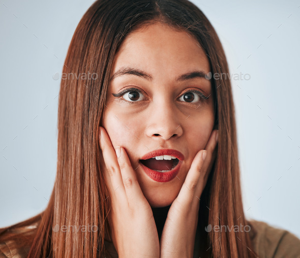 Shock, expression and portrait of a woman with a reaction isolated on a ...