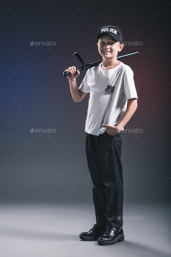 smiling boy in white tshirt and cap police officer uniform with ...