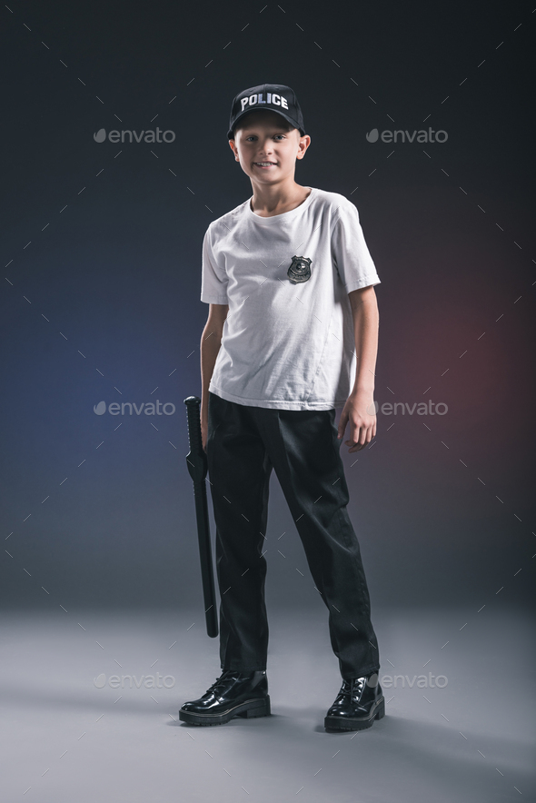 smiling boy in white tshirt and cap police officer uniform with ...