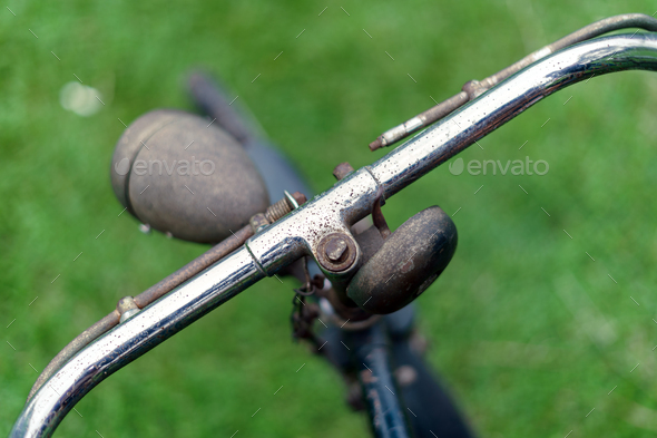 Roadster bike handlebars, lights, and bell Stock Photo by irfanmnur