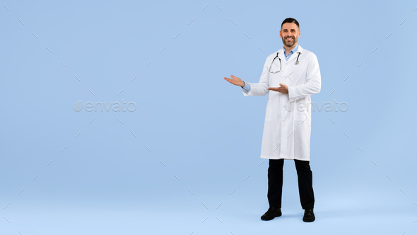 Medical advertisement. Happy male doctor pointing aside at free space ...