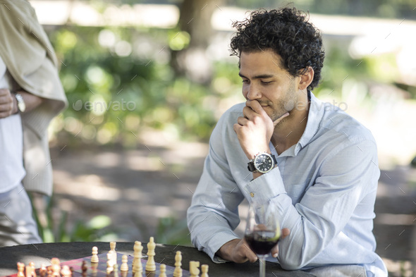 Man playing game of chess thinking Stock Photo by westend61 | PhotoDune