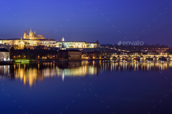 Prague Castle and Charles Bridge at night blue hour Stock Photo by frimufilms