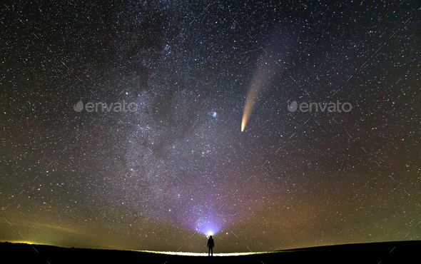 Small silhouette of a scientist with flashlight on his head pointing ...