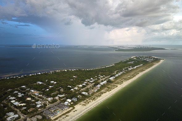 View from above of large storm approaching over residential houses in ...