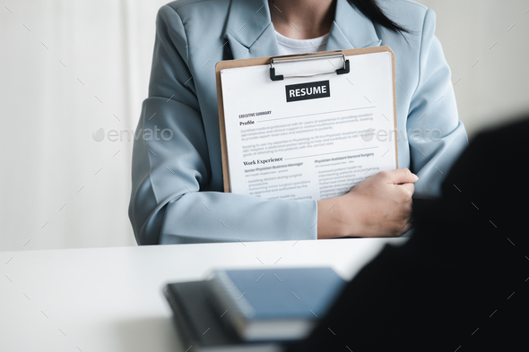 Person submitting resume to interview for a job with a company, Person ...