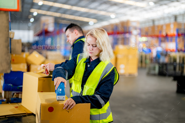 warehouse workers packing boxes for shipment Stock Photo by FoToArtist_1