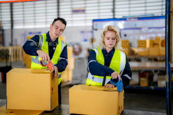 warehouse workers packing boxes for shipment Stock Photo by FoToArtist_1