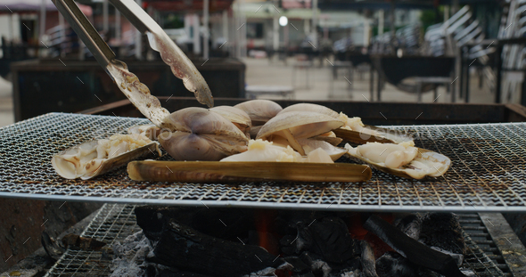 Fresh Short necked clam and Razor Clam on barbecue net Stock Photo by ...