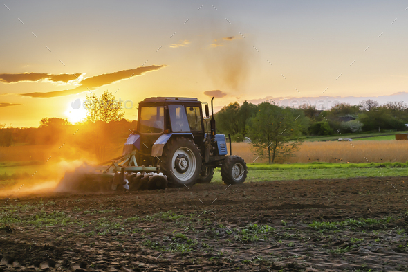 tractor machinery plowing agricultural field at farm.cultivating,soil ...