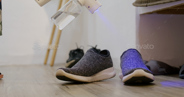 UV Light alcohol spray for cleaning pair of shoes Stock Photo by ...