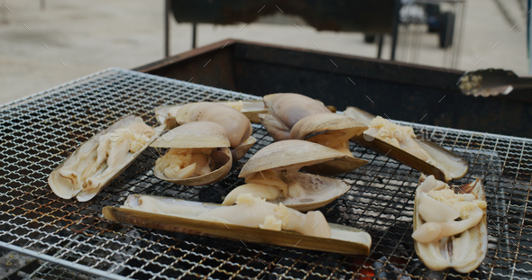 Fresh Short necked clam and Razor Clam on barbecue net Stock Photo by ...