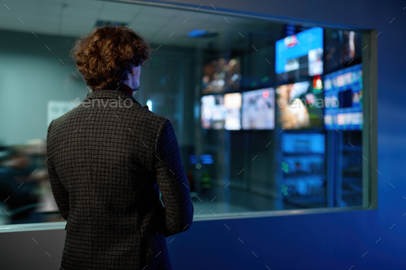 Man looking at computer screen reflection in server room window Stock ...