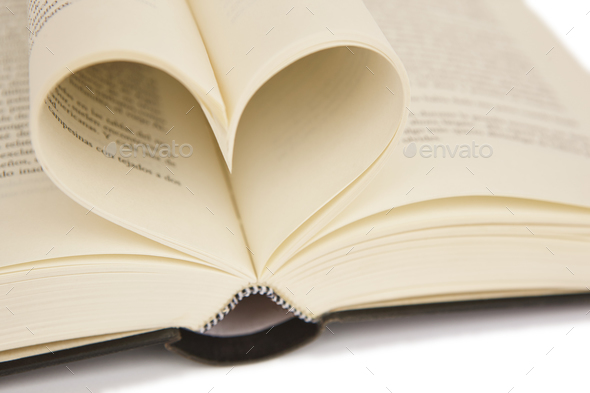 Open book with heart shaped pages. Love for reading Stock Photo by ABBPhoto