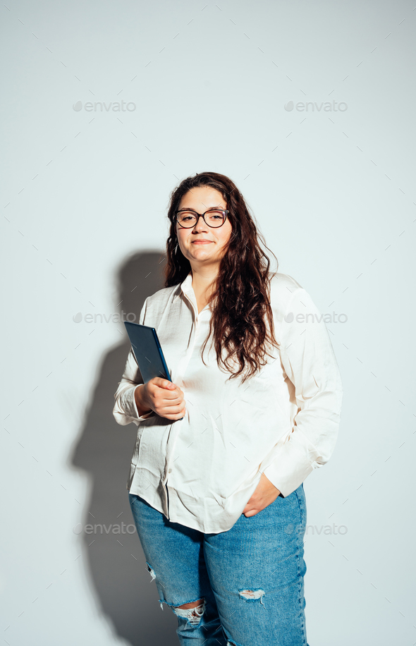 Plus size woman model posing in studio and having fun Stock Photo by ...