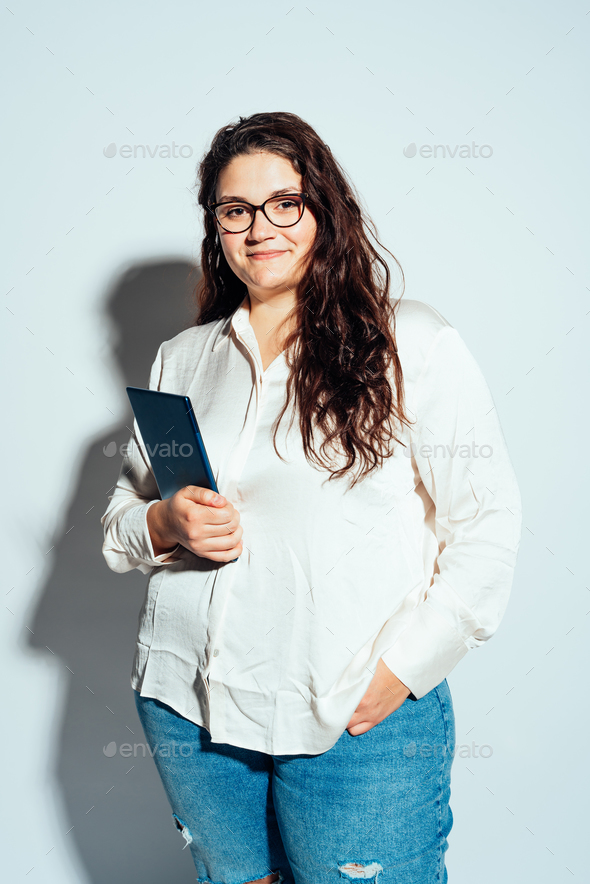 Plus size woman model posing in studio and having fun Stock Photo by ...
