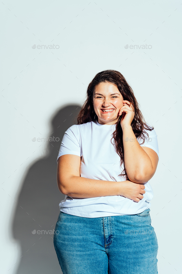 Plus size woman model posing in studio and having fun Stock Photo by ...