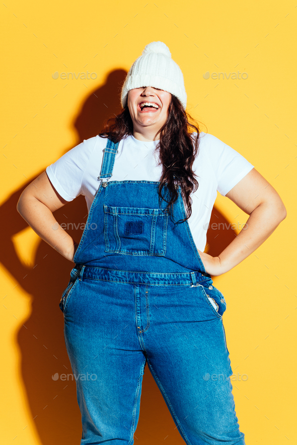 Plus size woman model posing in studio and having fun Stock Photo by ...