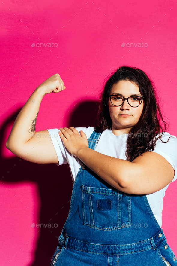 Plus size woman model posing in studio and having fun Stock Photo by ...