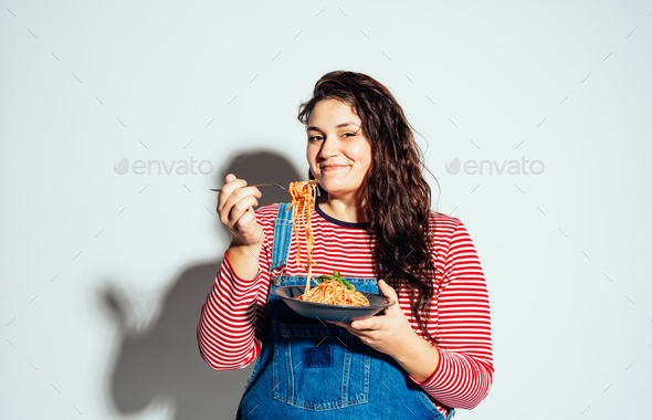 Plus size woman model posing in studio and having fun Stock Photo by ...