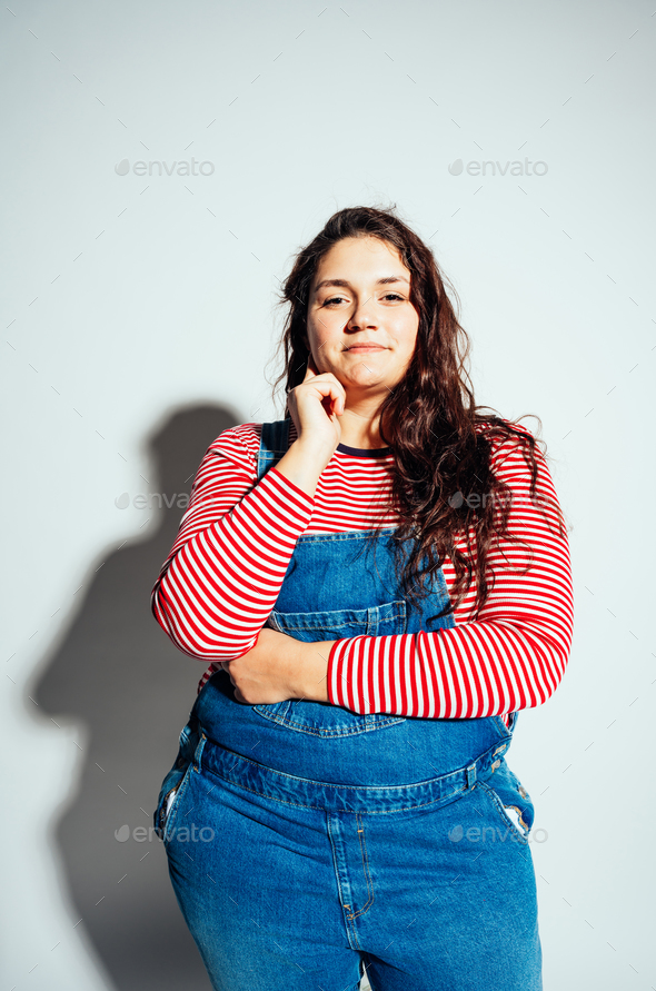 Plus size woman model posing in studio and having fun. Stock Photo by ...