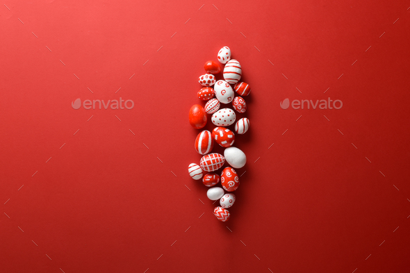 Easter backgrounds, scattered Easter red and white eggs on a bright red ...