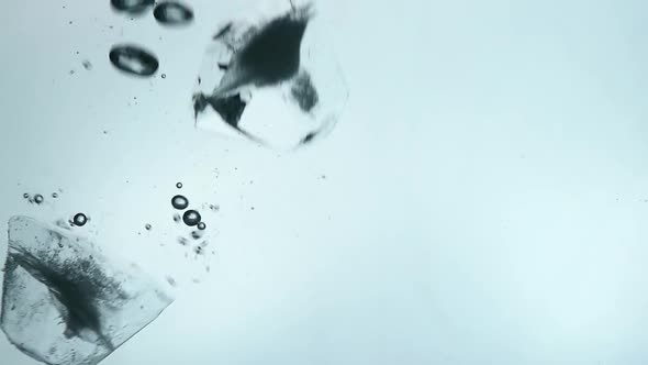 Throwing Ice Cubes Into Water, Stock Footage | VideoHive