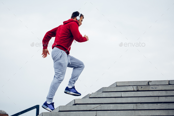 Handsome man running up at stairs Stock Photo by djile | PhotoDune