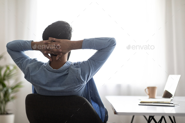 Rear View of Male Freelancer Resting At Workplace In Home Office Stock ...