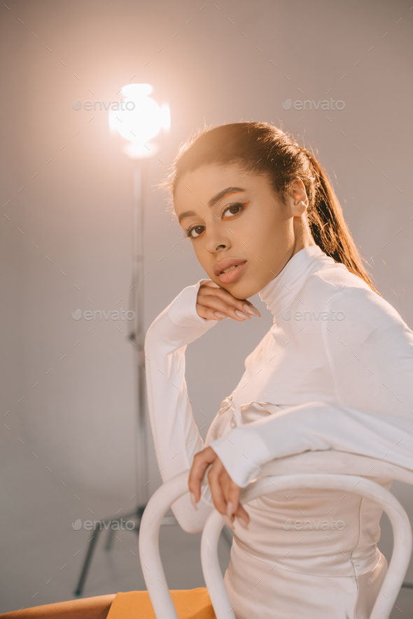 attractive african american female model posing and looking at camera ...