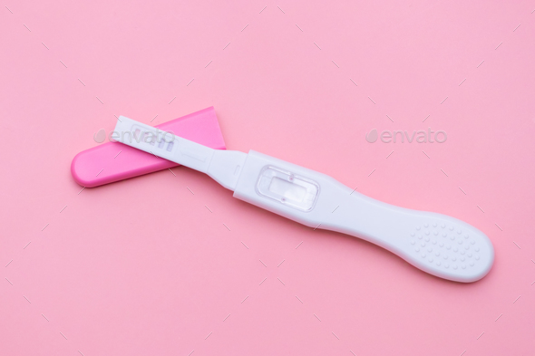 Unused pregnancy test isolated on the pink background Stock Photo by ...