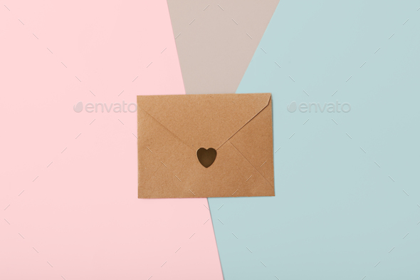 Craft paper envelope on the trendy triple background with golden ...
