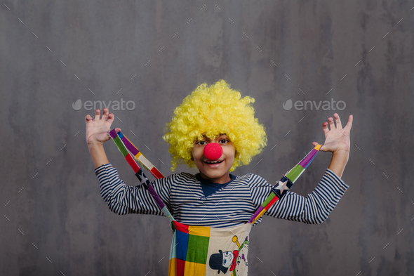 Portrait of little boy in clown costume. Stock Photo by halfpoint ...