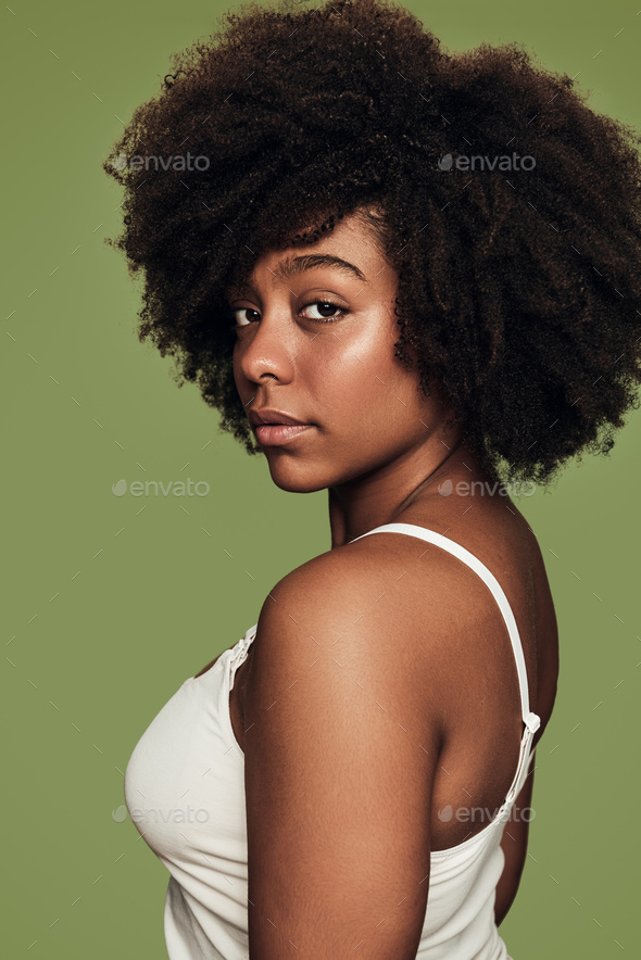 Black female model with Afro hairstyle in studio Stock Photo by kegfire