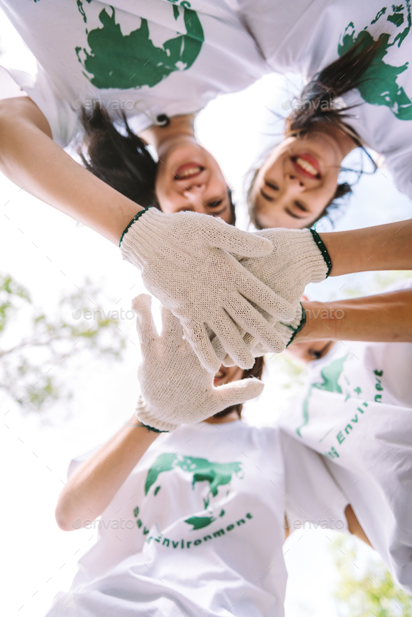 Volunteer group of diverse asian people joining charity event to ...
