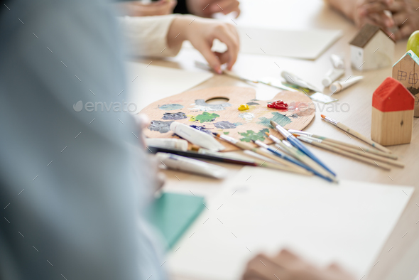 Background of drawing and painting tools on the table. color palette ...