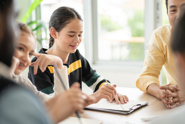 Girl attend class with classmate at school. student sitting at the ...