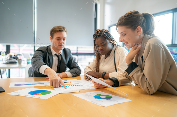Business discussions. Shot of business people brainstorming in an ...