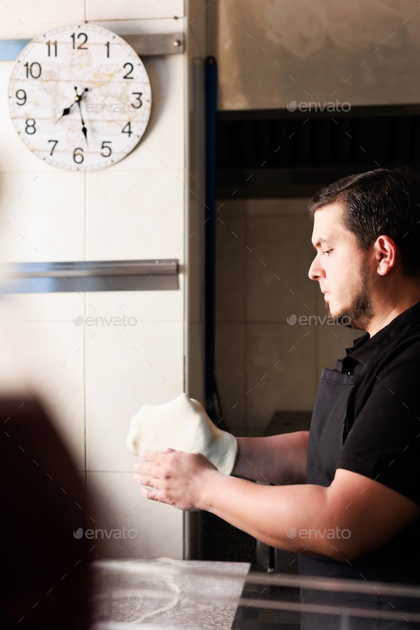 Latin Pizzeria chef cook pizza in professional uniform. restaurant ...