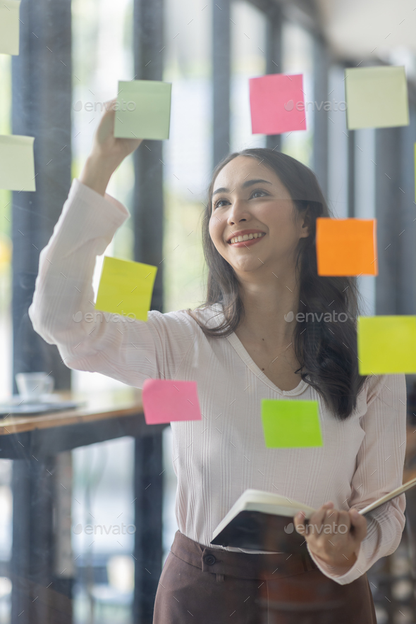 Business female employee with many conflicting priorities arranging ...