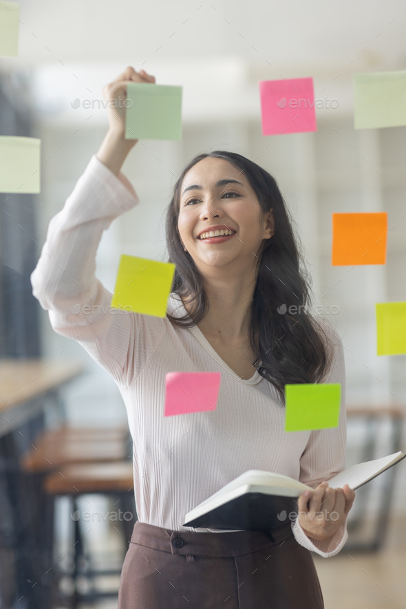 Business female employee with many conflicting priorities arranging ...