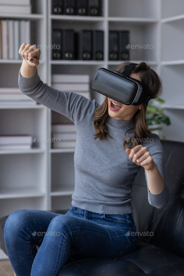 Surprised Young latin woman in VR headset touching air, Smiling white woman wearing vr glasses ...