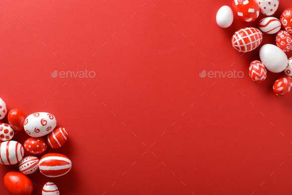 Easter backgrounds, scattered Easter red and white eggs on a bright red ...
