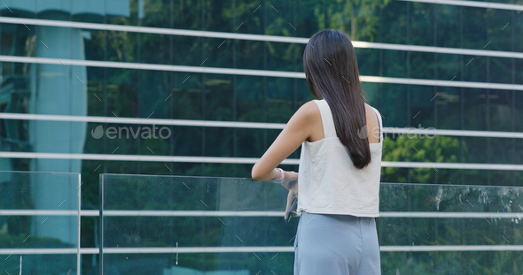Woman look at the view with the office building background Stock Photo ...