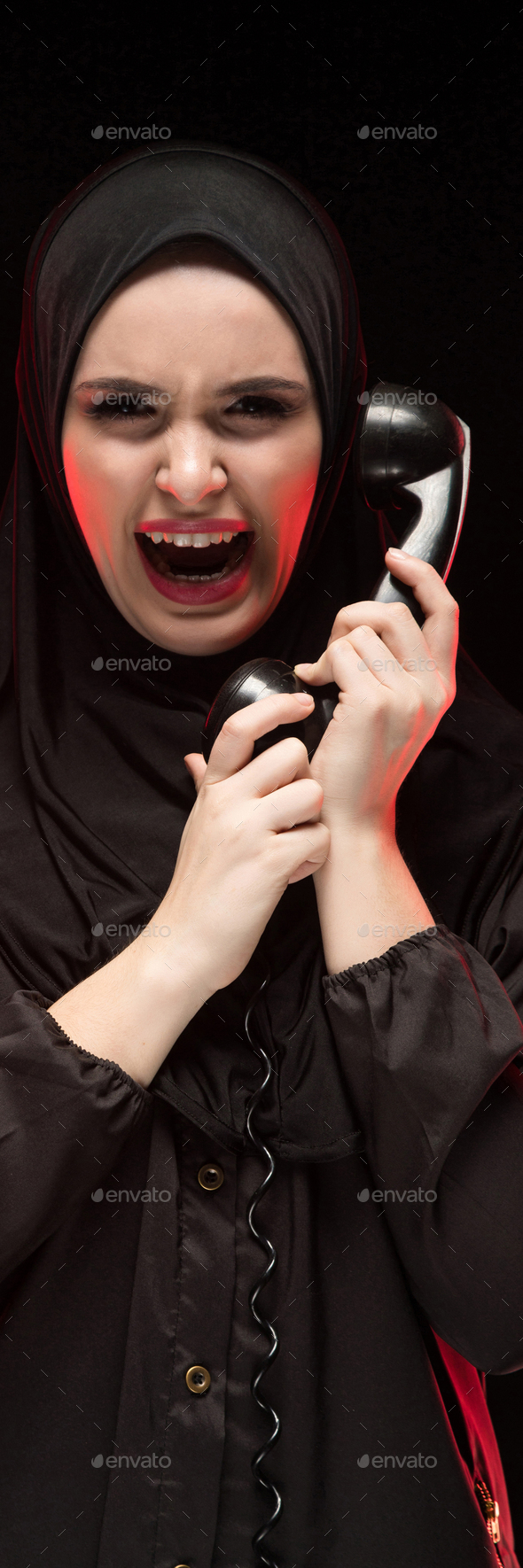 Portrait of beautiful serious scared young muslim woman wearing black ...