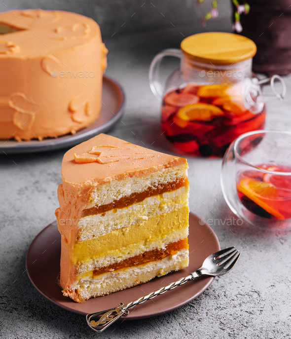 Delicious mango and passion fruit mousse cake Stock Photo by AntAlexStudio