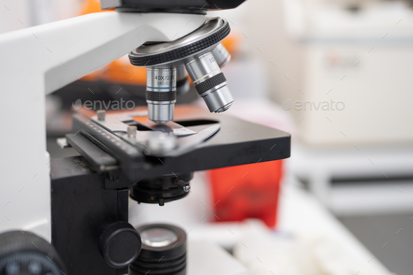 Microscope analyzing a specimen Stock Photo by GSR-PhotoStudio | PhotoDune