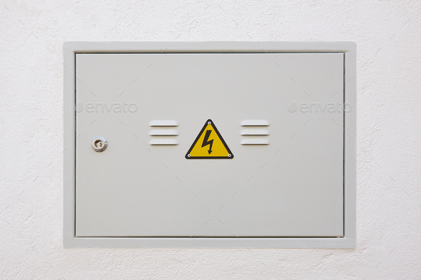 Electric meter box metallic door and white wall. Warning Stock Photo by ...