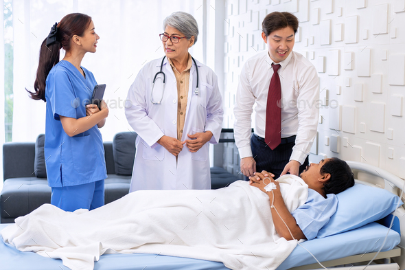 Hospital treatment room relative visit patient lay on bed doctor ...