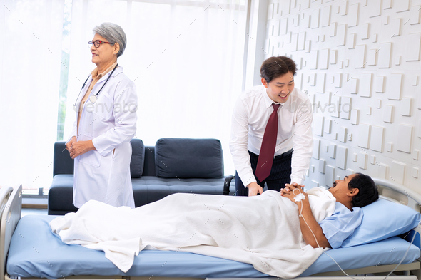Hospital treatment room relative visit patient lay on bed doctor ...